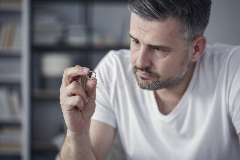 Man Looking at Wedding Ring Stock Image - Image of quarrel ...