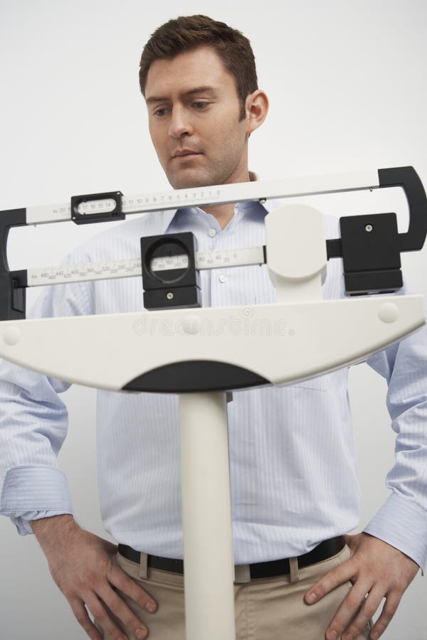 Happy Man Measuring Weight on Weighing Scale Stock Image - Image of ...