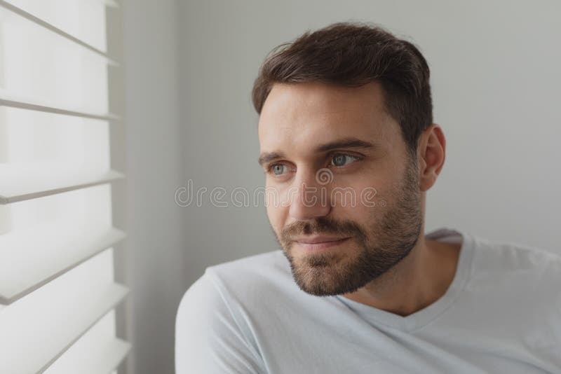 Man Looking through Window in a Comfortable Home Stock Image - Image of ...