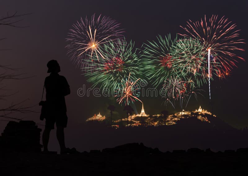 The Man Looks Holiday Fireworks in the Evening Sky Stock Image - Image ...
