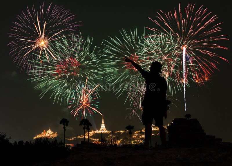 The Man Looks Holiday Fireworks in the Evening Sky Stock Photo - Image ...