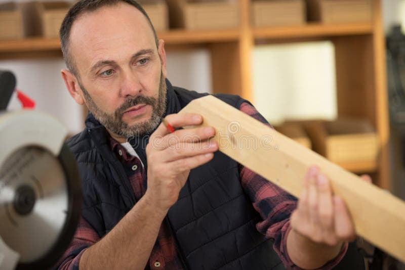 Man Looks at Piece Wood in Workshop Stock Photo - Image of disk ...