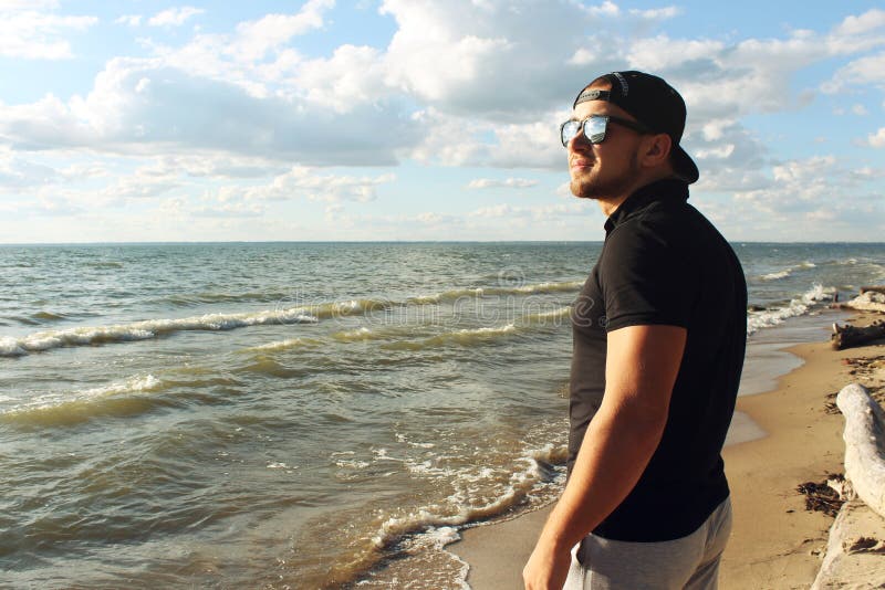 A man looks at sea stock photo. Image of muscular, look - 77765450