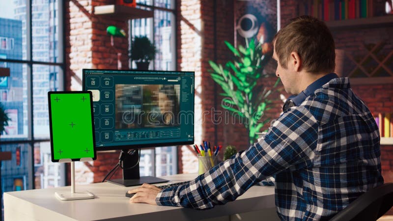 Man Looks at Tutorial on Chroma Key Tablet about AI Virtual Assistant ...