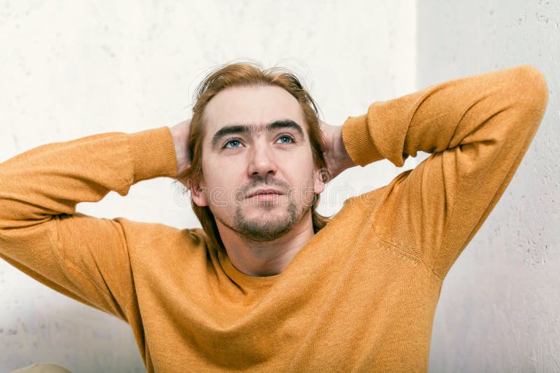 Man Looks Up Holding His Hands on the Back of His Head Stock Image ...