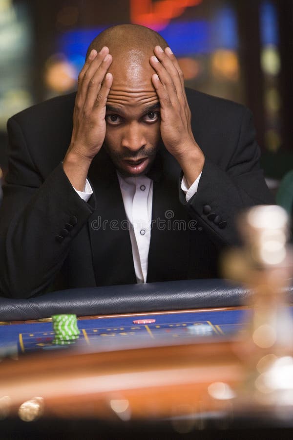 Man Losing at Roulette Table Stock Photo - Image of evening, lifestyle ...