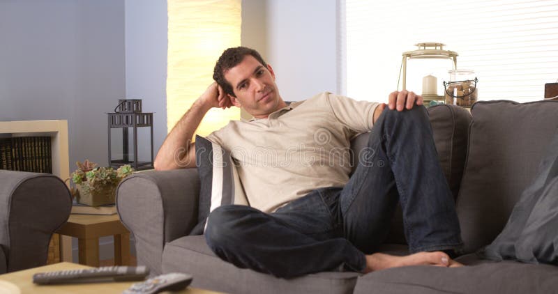 Man lounging on sofa stock image. Image of lounging, alone - 44820689