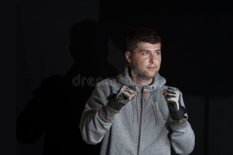 Man in low key light stock photo. Image of dark, aggression - 48971878