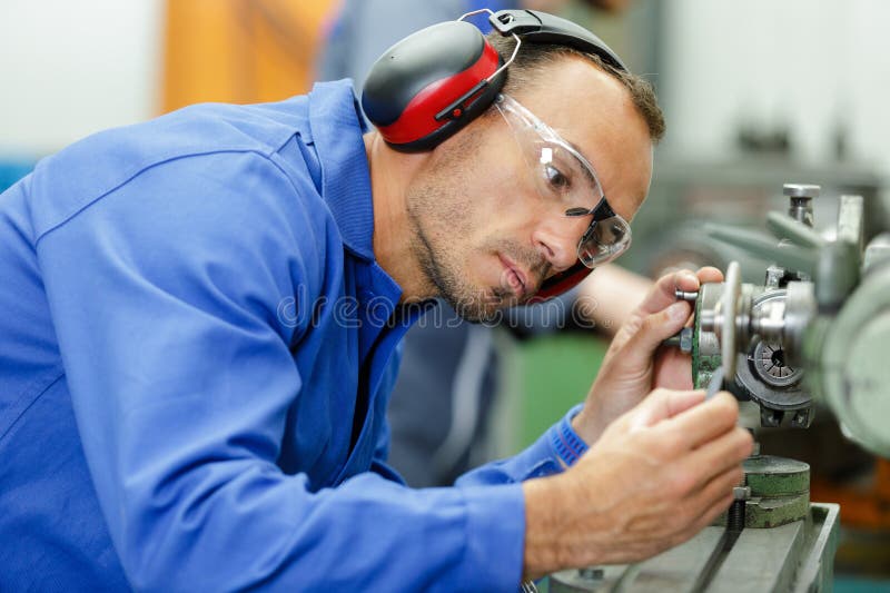 Man lubricates machine stock image. Image of ecentic - 272481647