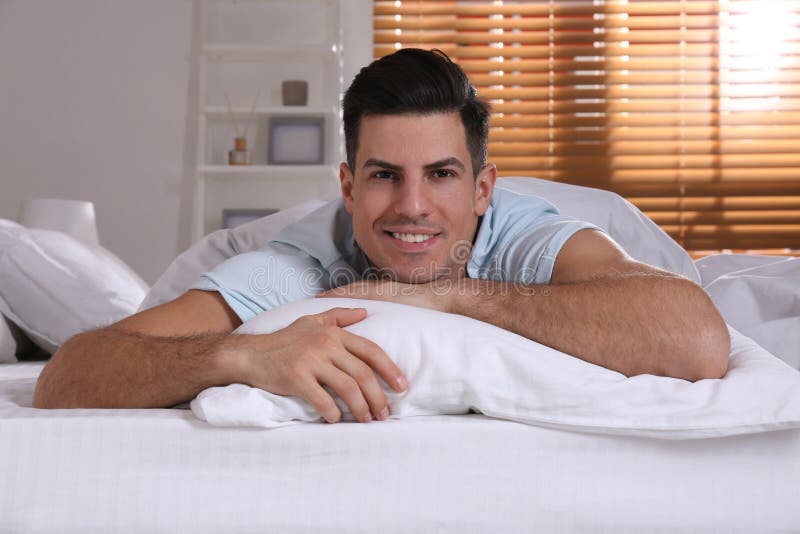Man Lying in Comfortable Bed with White Linens Stock Image - Image of ...
