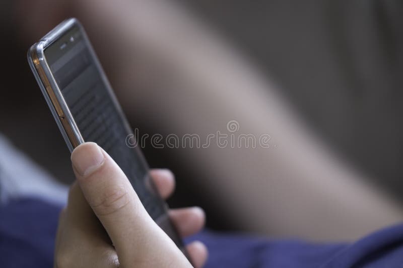 Man Scrolling and Reading Messages on His Smartphone Stock Image ...