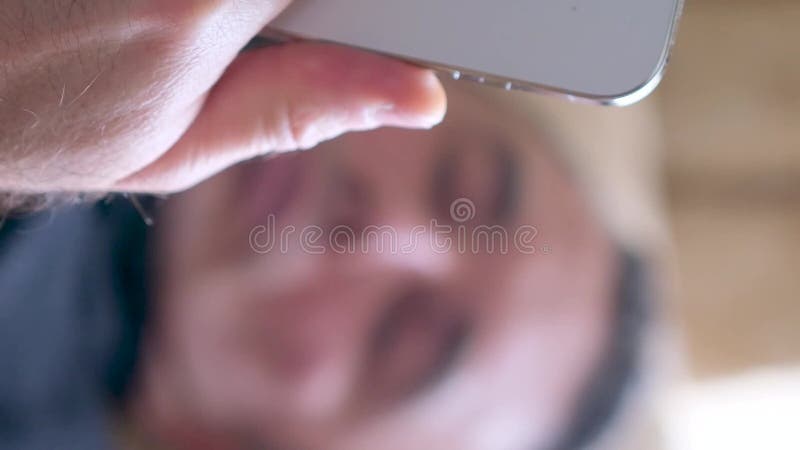 Man Lying Down on Couch while Looking at His Cell Phone Alone at Night ...