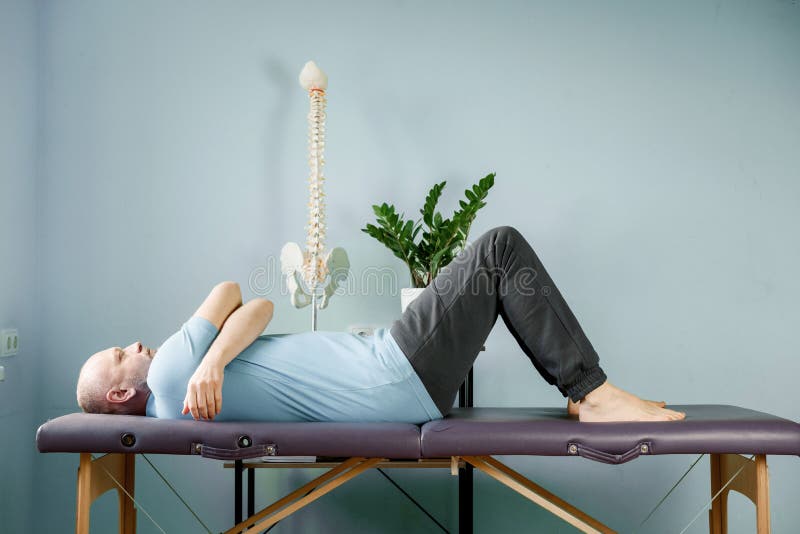 A Man Lying on the Massage Table in Constructive Rest Postion Stock ...