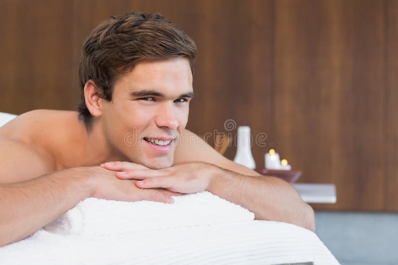 Man Lying on Massage Table at Spa Center Stock Photo - Image of ...