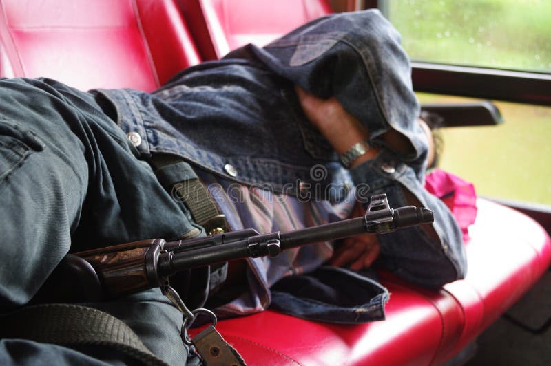 Soldier Holds a Machine Gun between His Legs while he is Having a ...