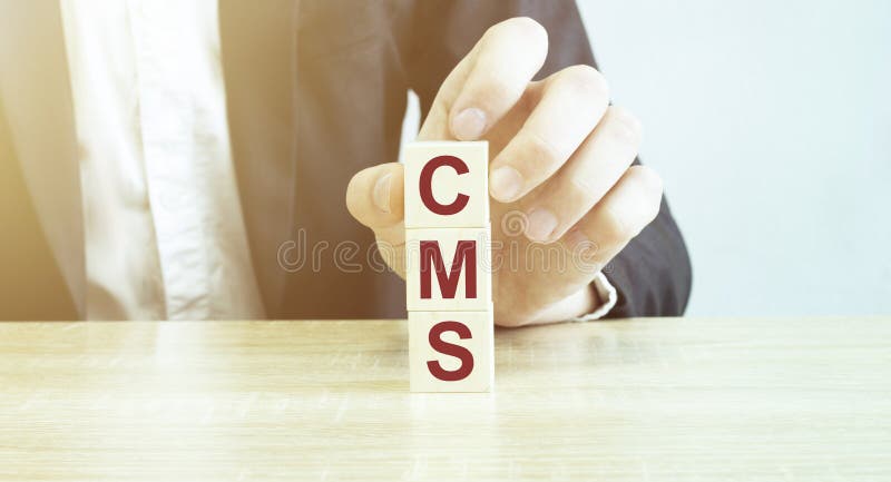 Man Made Word CMS with Wood Blocks Stock Image - Image of trainer ...
