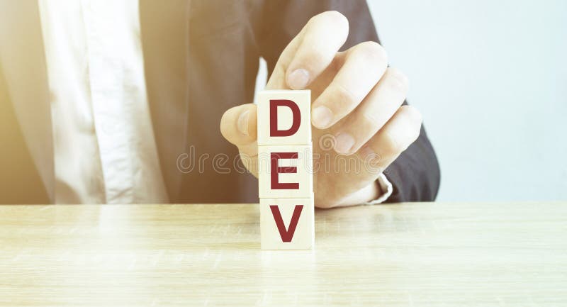 Man Made Word Dev with Wood Blocks Stock Photo - Image of technology ...