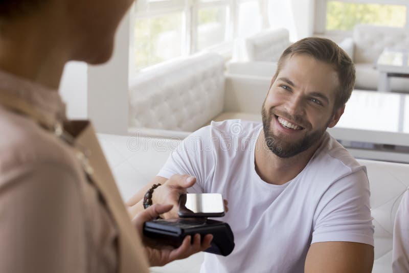 Man Makes Cashless Checkout in Restaurant Using NFC Technology Stock ...