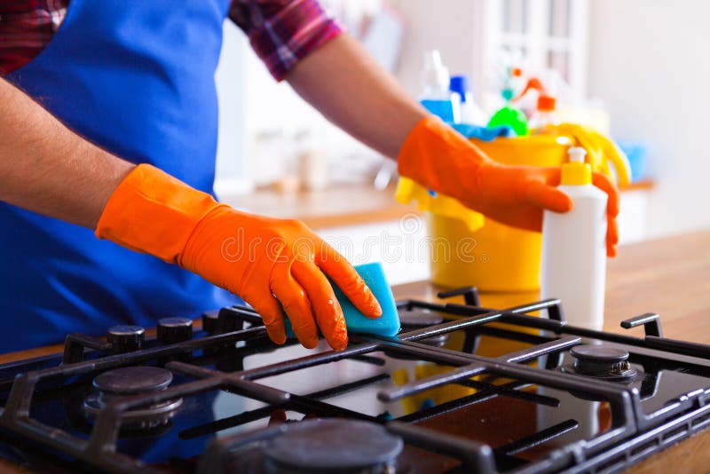 Man Makes Cleaning the Kitchen. Young Man Washes an Oven. Cleaning ...