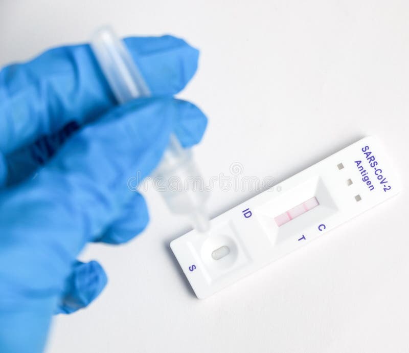 Man Makes a Covid-19 Antigen Pcr Test Macro. the Test Showed a Positive ...