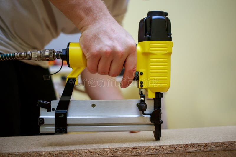 Man Working with Pneumatic Stapler Stock Photo - Image of stapler ...