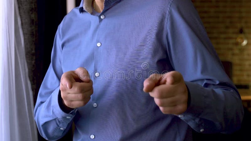 The Man Makes a Gesture with His Hands, Pointing His Fingers Forward ...