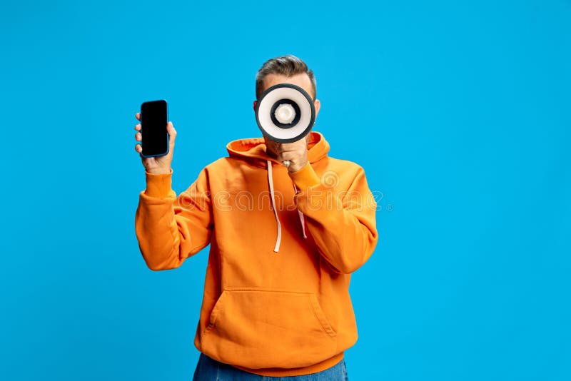 Man Makes Powerful Statement with Megaphone and Smartphone in Hand ... Man Makes Powerful Statement with Megaphone and Smartphone in Hand ...