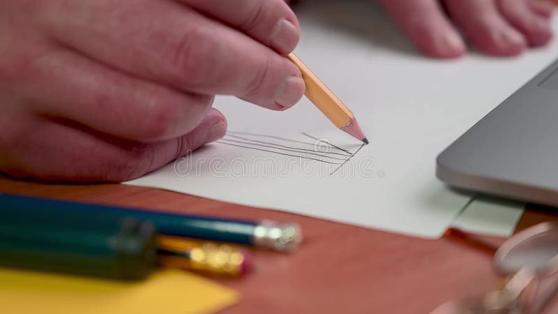 A Man Makes a Sketch on Paper with a Pencil. Architect Workflow Stock ...