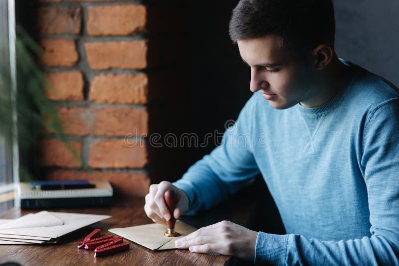 Man Makes the Stamp Using Sealing Wax on the Envelope Stock Photo ...
