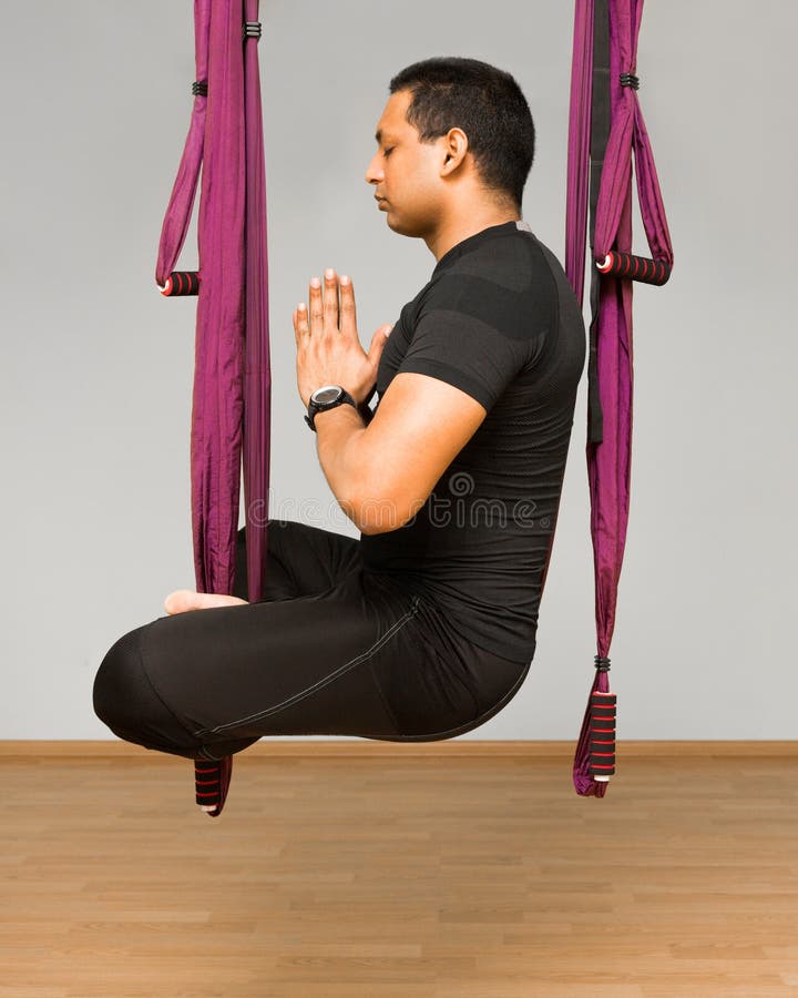 Man Making Aerial Yoga Exercises, Indoor Stock Photo - Image of hammock ... Man Making Aerial Yoga Exercises, Indoor Stock Photo - Image of hammock ...