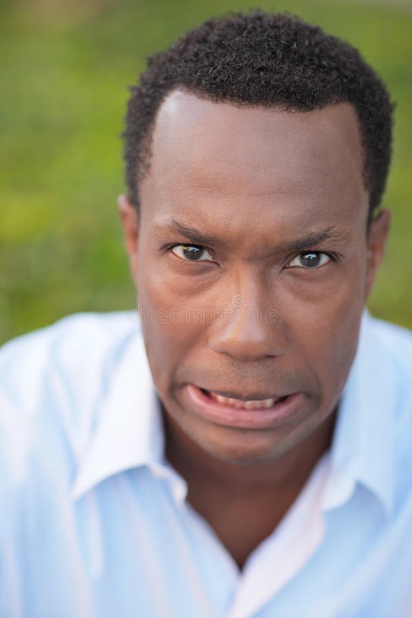 Man making an angry face stock photo. Image of outdoors - 18059956