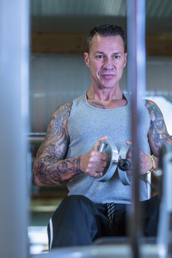 Man Making Cable Row - Workout Routine Stock Image - Image of pulley ...