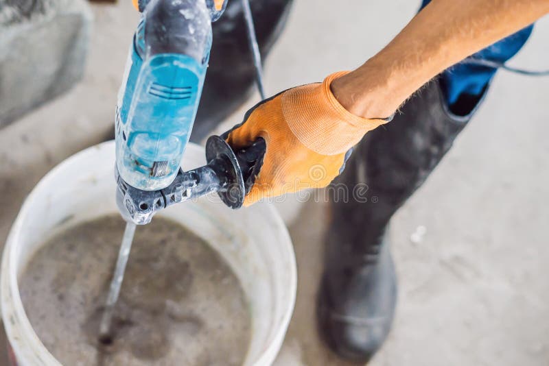 Man Making Cement with a Construction Mixer in a Bucket Stock Image ...