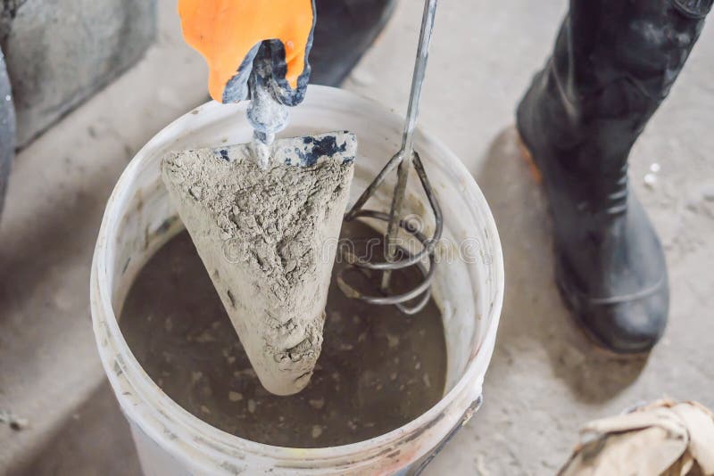 Man Making Cement with a Construction Mixer in a Bucket Stock Image ...