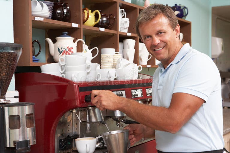 Man Making Coffee in Cafe stock photo. Image of making - 16053254