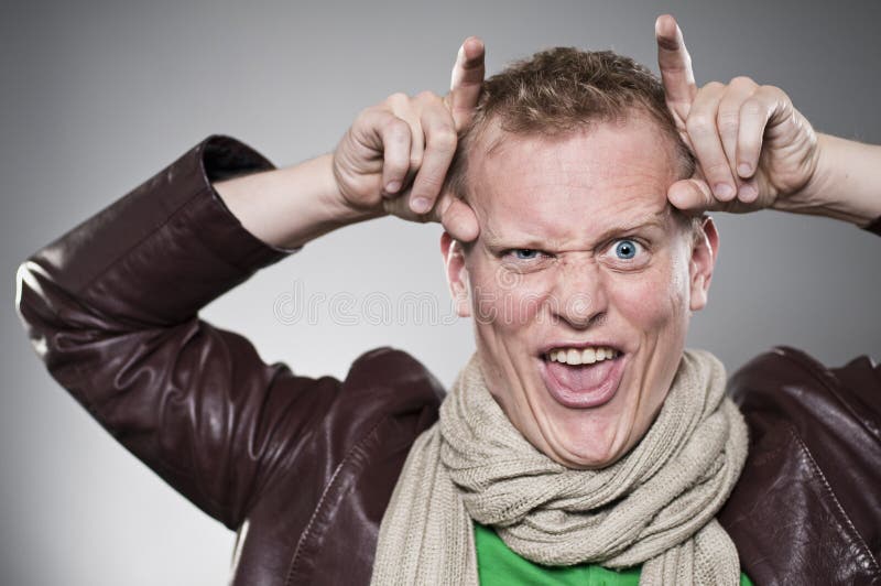 Man Making Devil Horns Portrait Stock Photo - Image of open, face: 31677966