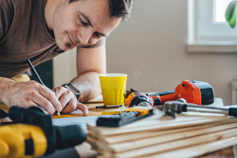 Man Making Draft Plan with Pencil on the Table Stock Photo - Image of ...