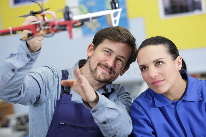 Man Making Drone Model with Female Apprentice Stock Image - Image of ...