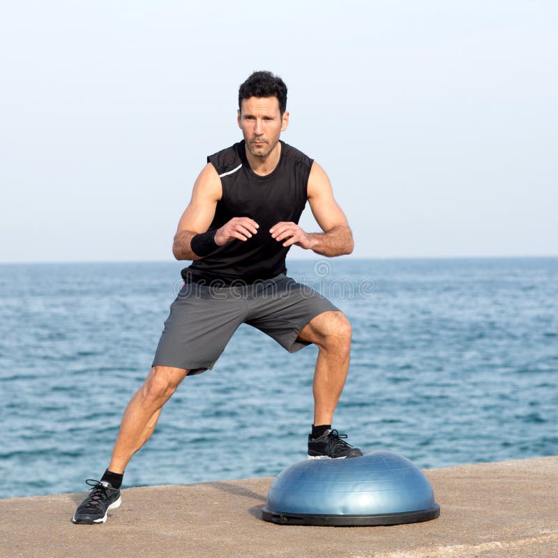 Man Making Exercise on Balance Platform Stock Photo - Image of training ...