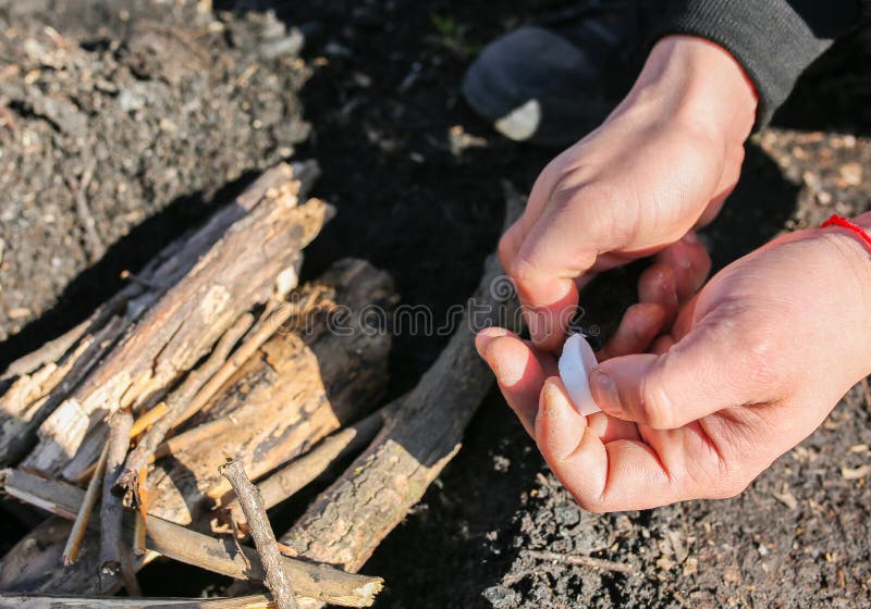 Man is Making Fire from Solid Alcohol. Tourist in the Nature Outdoors ...