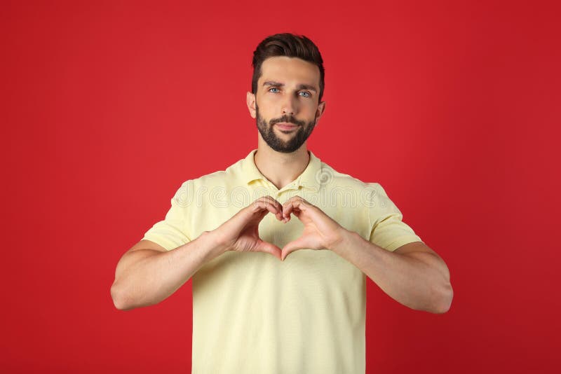 Man Making Heart with Hands on Red Background Stock Image - Image of ...