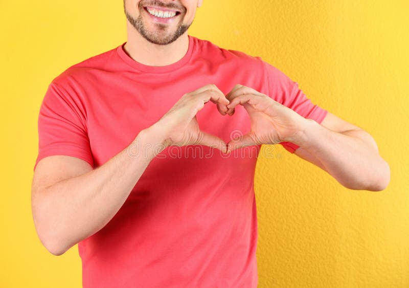Man Making Heart With His Hands On Color Background Stock Photo - Image ...