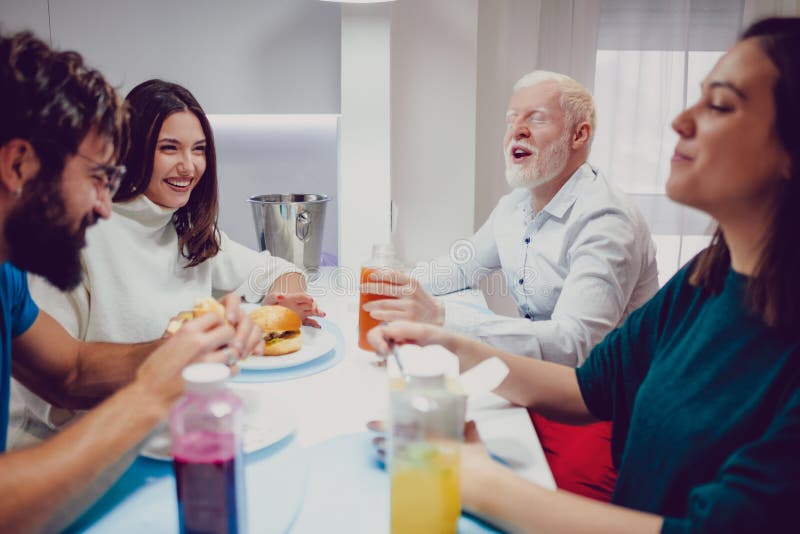 Man Making His Friends Laughing at the Lunch Stock Image - Image of ...