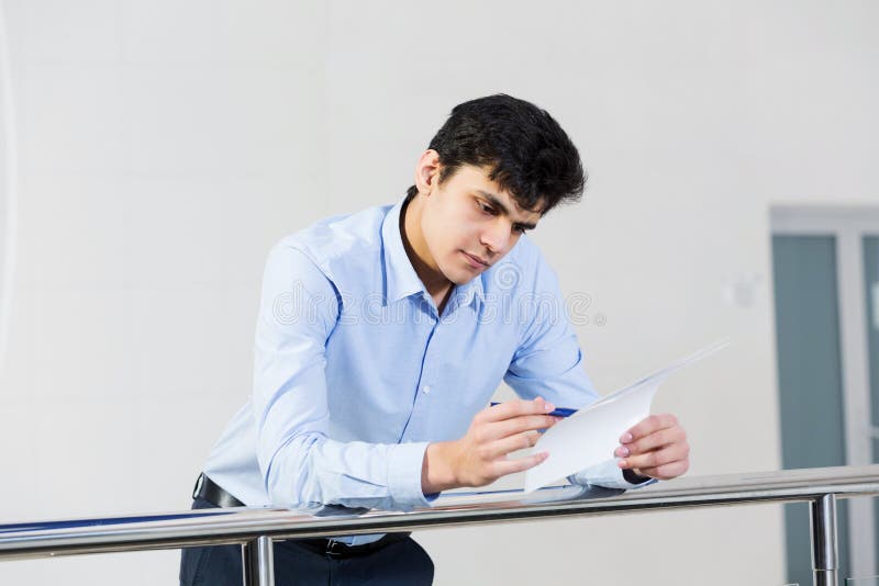 Man making notes stock photo. Image of holding, paper - 57817626