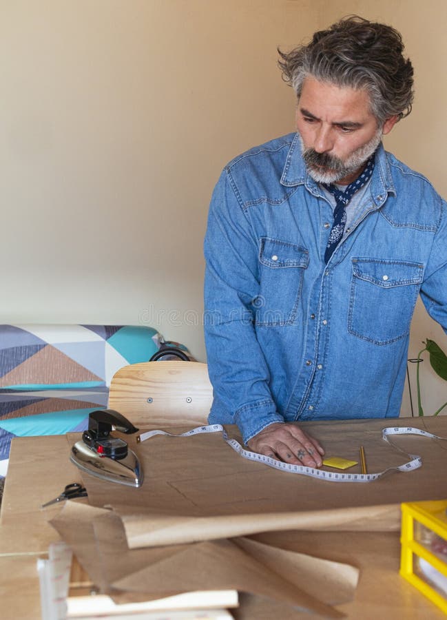 A Man Making a Pattern for a Clothing Design Stock Photo - Image of ...