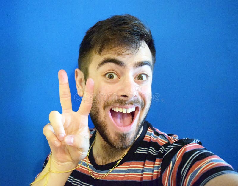 Man making a peace sign stock image. Image of selfie - 104183881