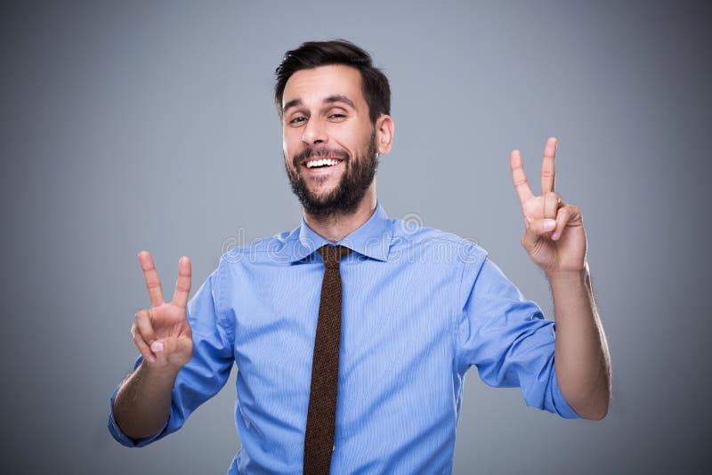 Man Making Peace Sign stock photo. Image of teenager - 12213810