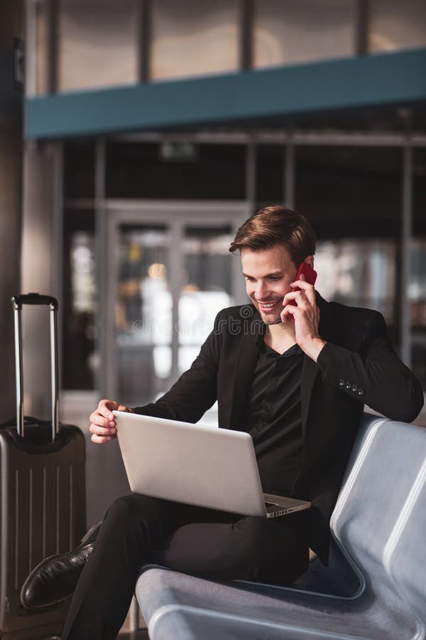 Man Making a Phone Call while Waiting for the Boarding Stock Photo ...