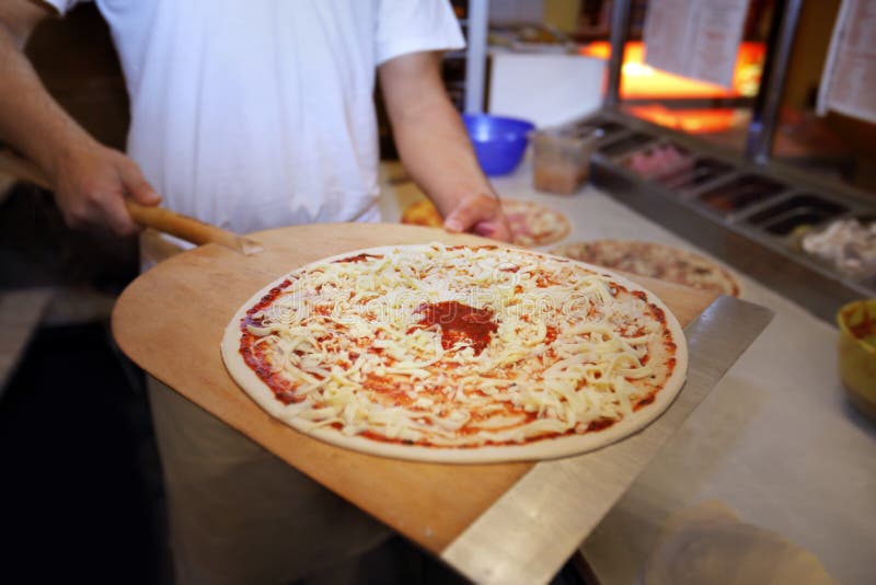 Man Making a Pizza stock image. Image of drink, small - 18241683