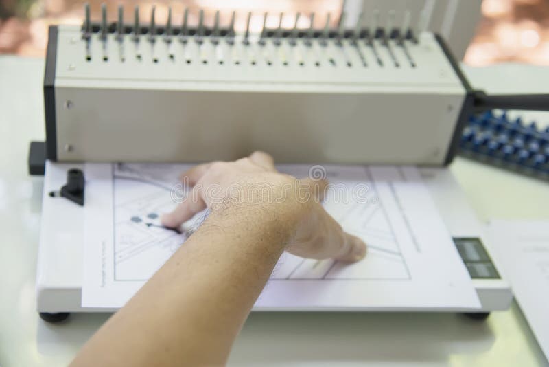 Man Making Report Using Comb Binding Machine Stock Photo - Image of ...
